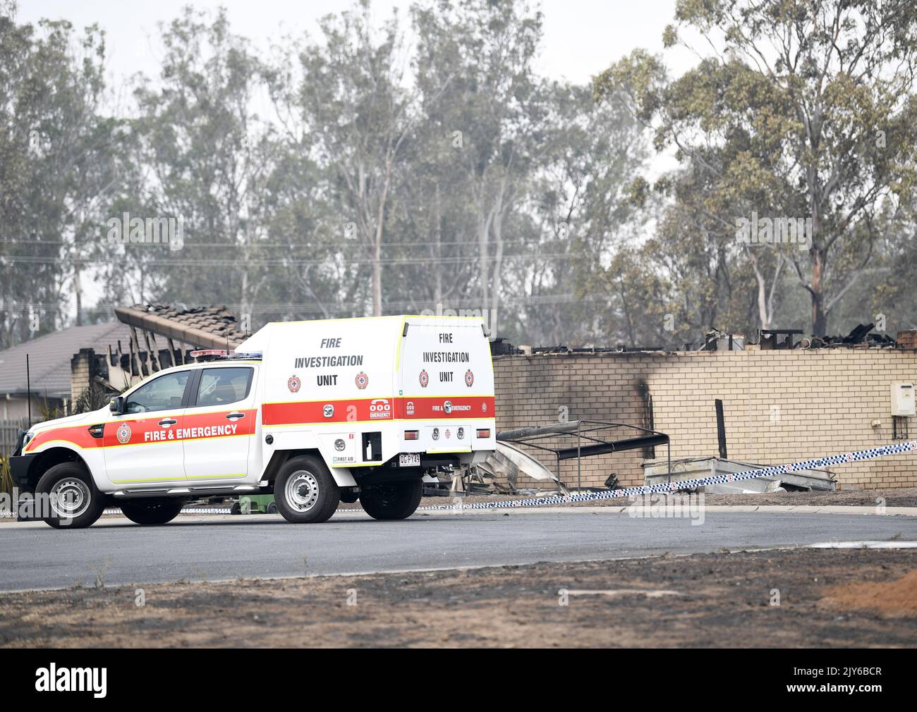 A Fire Investigation Unit is seen in front of a burnt down house in ...