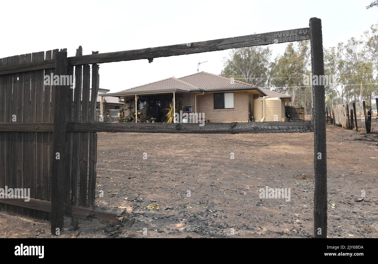 A fence damaged by bushfires is seen in Laidley, southeast Queensland ...