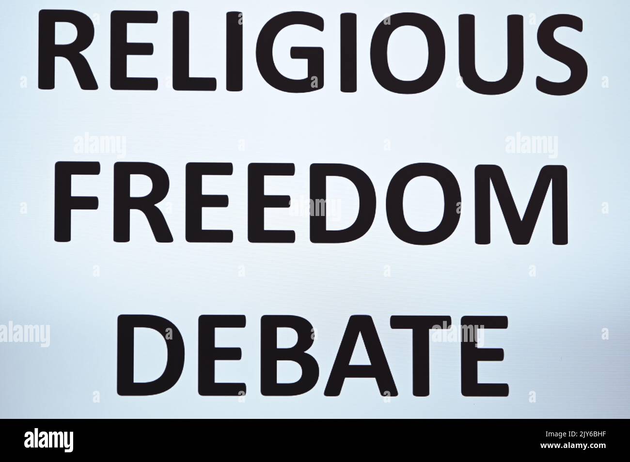 A sign saying ' Religious Freedom Debate' is seen during a debate on ...