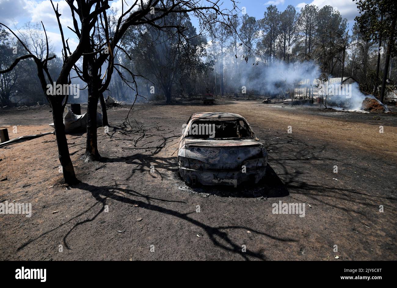 A car destroyed by bushfire is seen in Rappville, NSW, Thursday ...