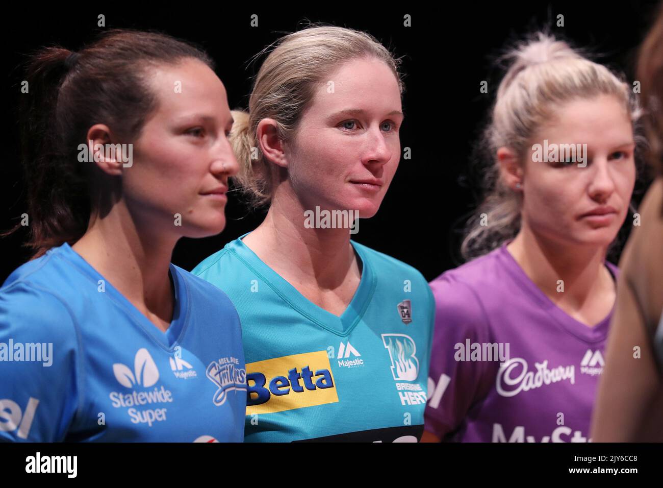 Beth Mooney of the Brisbane Heat (center) looks on during the WBBL ...