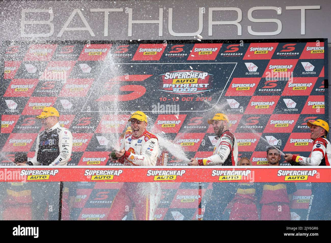 Scott McLaughlin (centre) of the Shell V-Power Racing Team celebrates ...