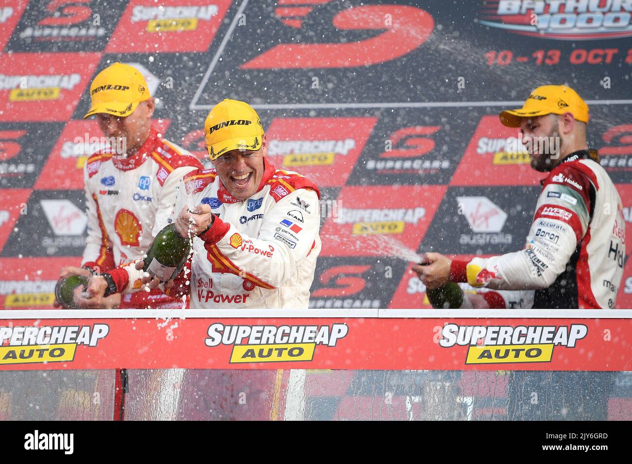 Scott McLaughlin (centre) of the Shell V-Power Racing Team celebrates ...