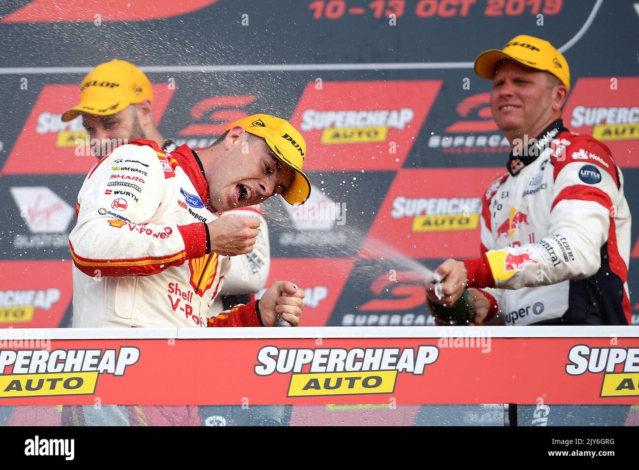 Scott McLaughlin (centre) of the Shell V-Power Racing Team celebrates ...