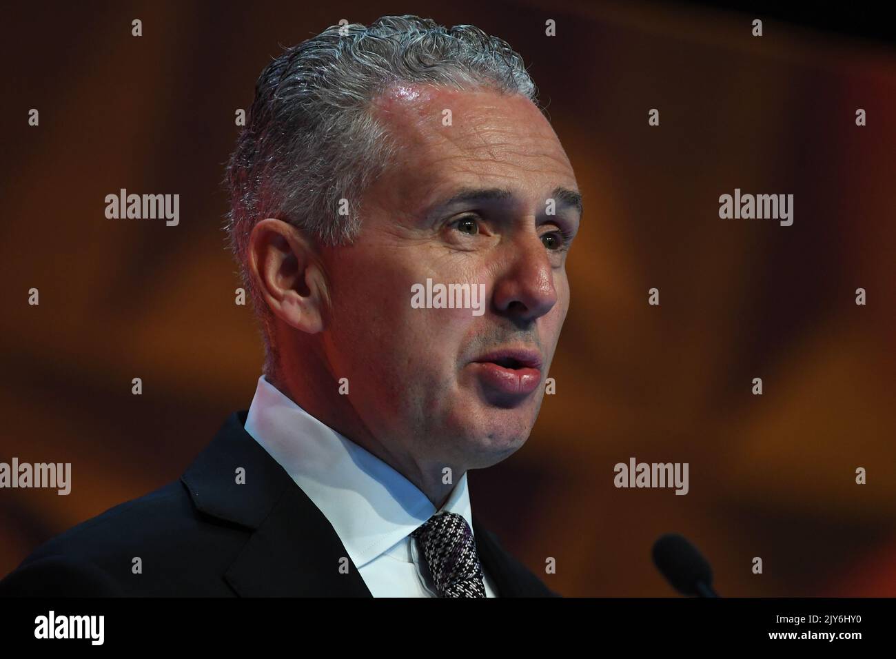 Telstra Chief Executive Officer Andy Penn addresses the floor during ...