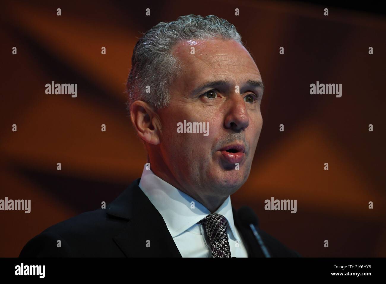 Telstra Chief Executive Officer Andy Penn addresses the floor during ...