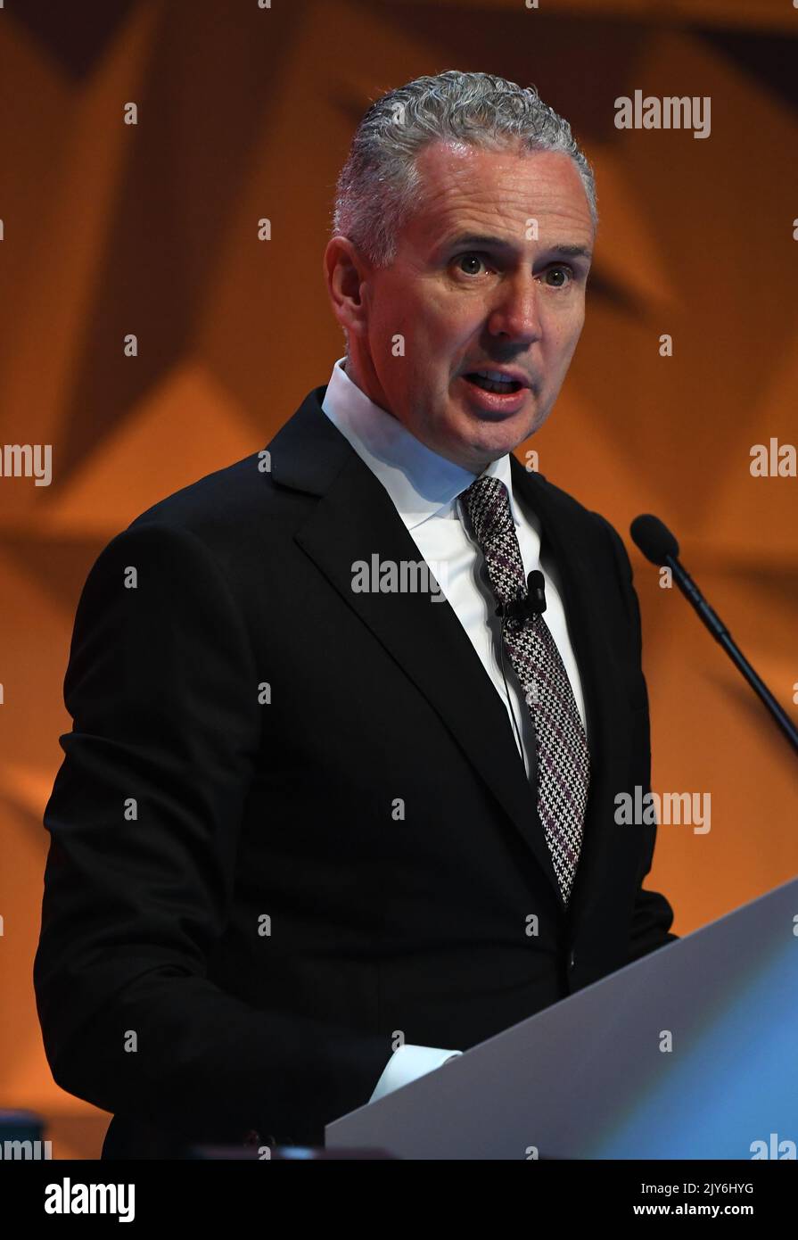 Telstra Chief Executive Officer Andy Penn addresses the floor during ...