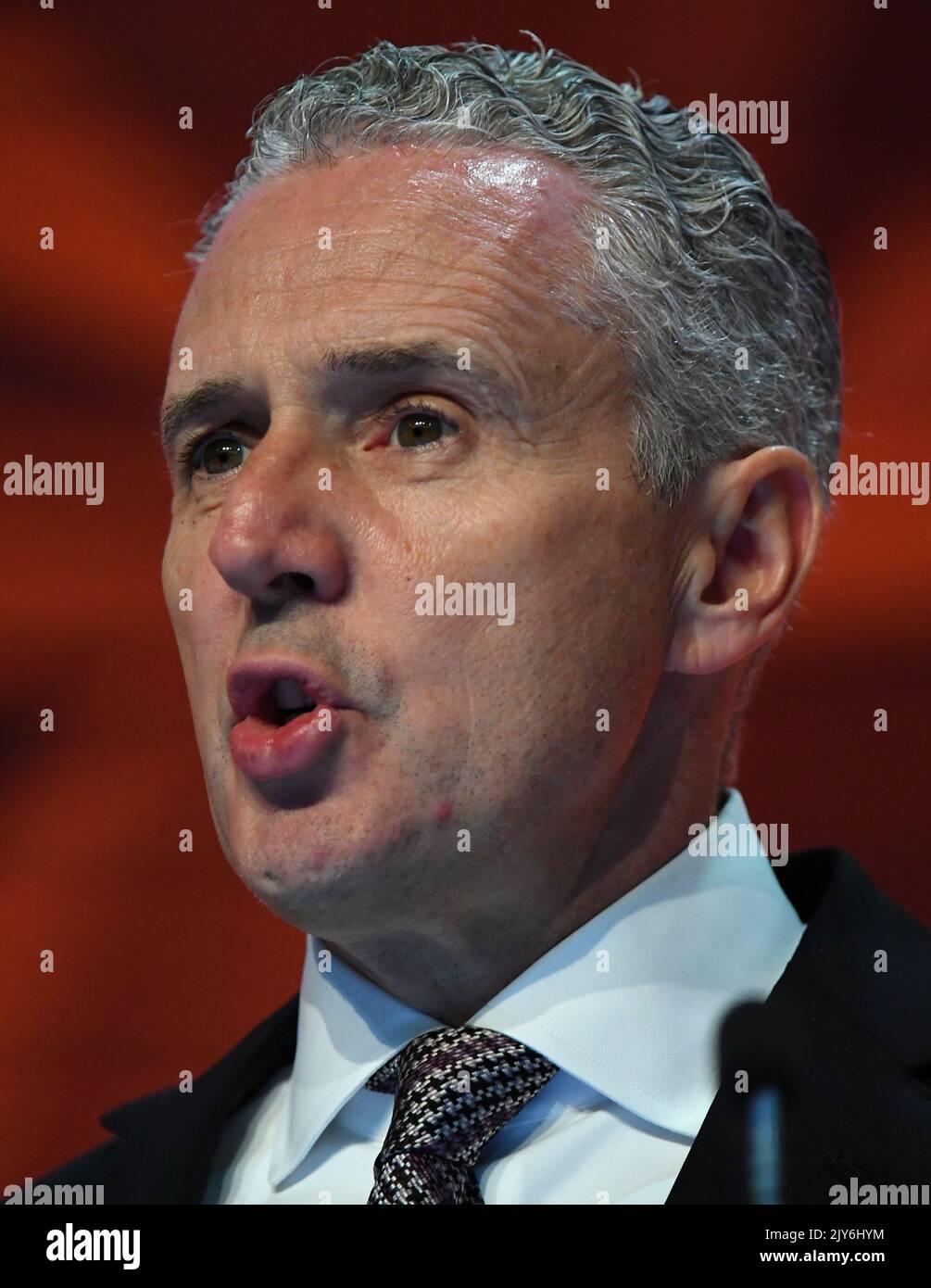 Telstra Chief Executive Officer Andy Penn addresses the floor during ...