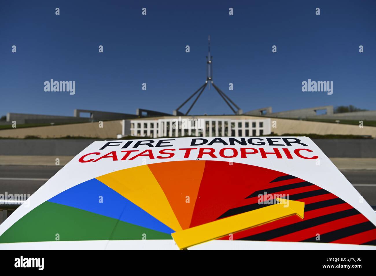 A fire danger is seen during Climate Change rally outside Parliament ...