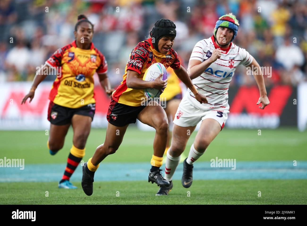 Ua Ravu of PNG runs the ball in the Women's Pool game between England ...