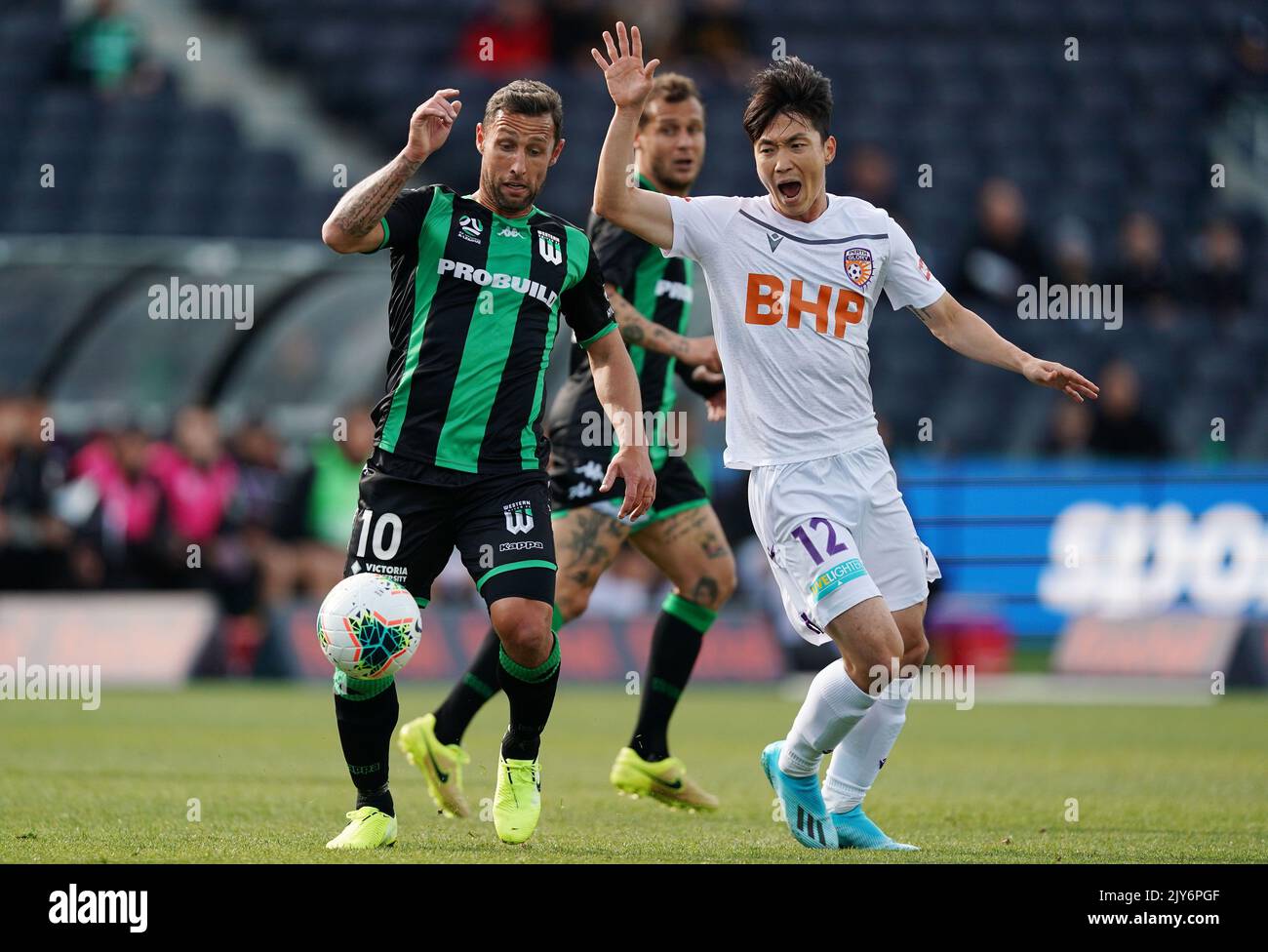 Scott McDonald of Western United FC and Kim Soo-beom of Perth Glory FC ...