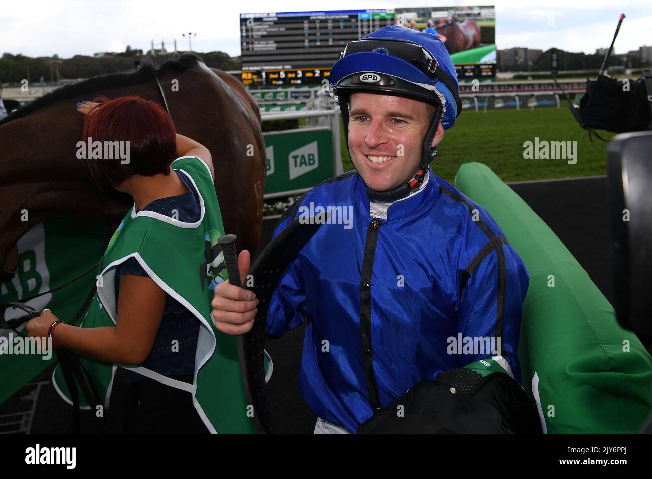 Jockey Tommy Berry gestures after riding Happy Clapper to victory in ...