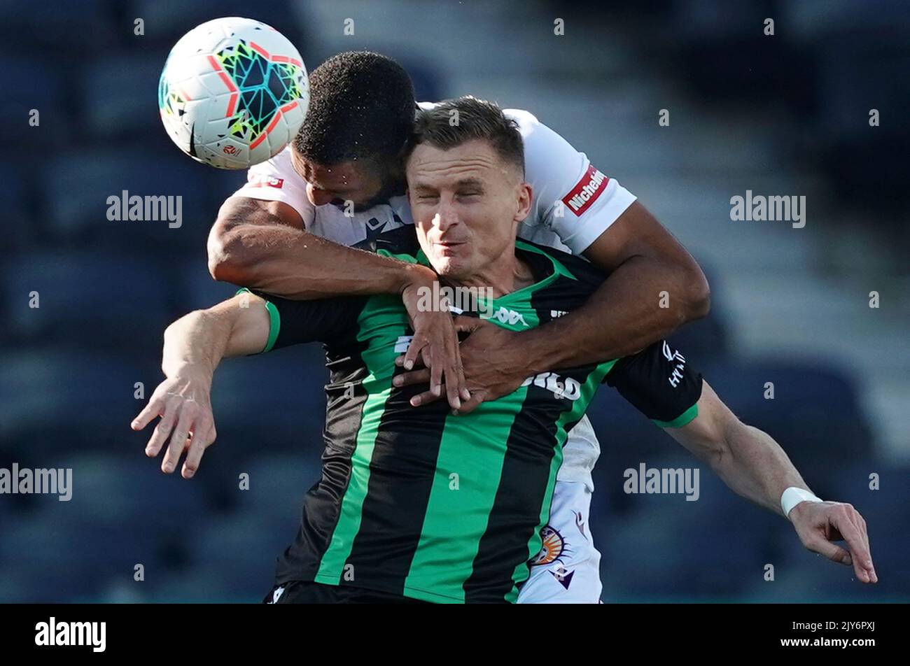 Besart Berisha of Western United FC and Gregory Wuthrich of Perth Glory ...