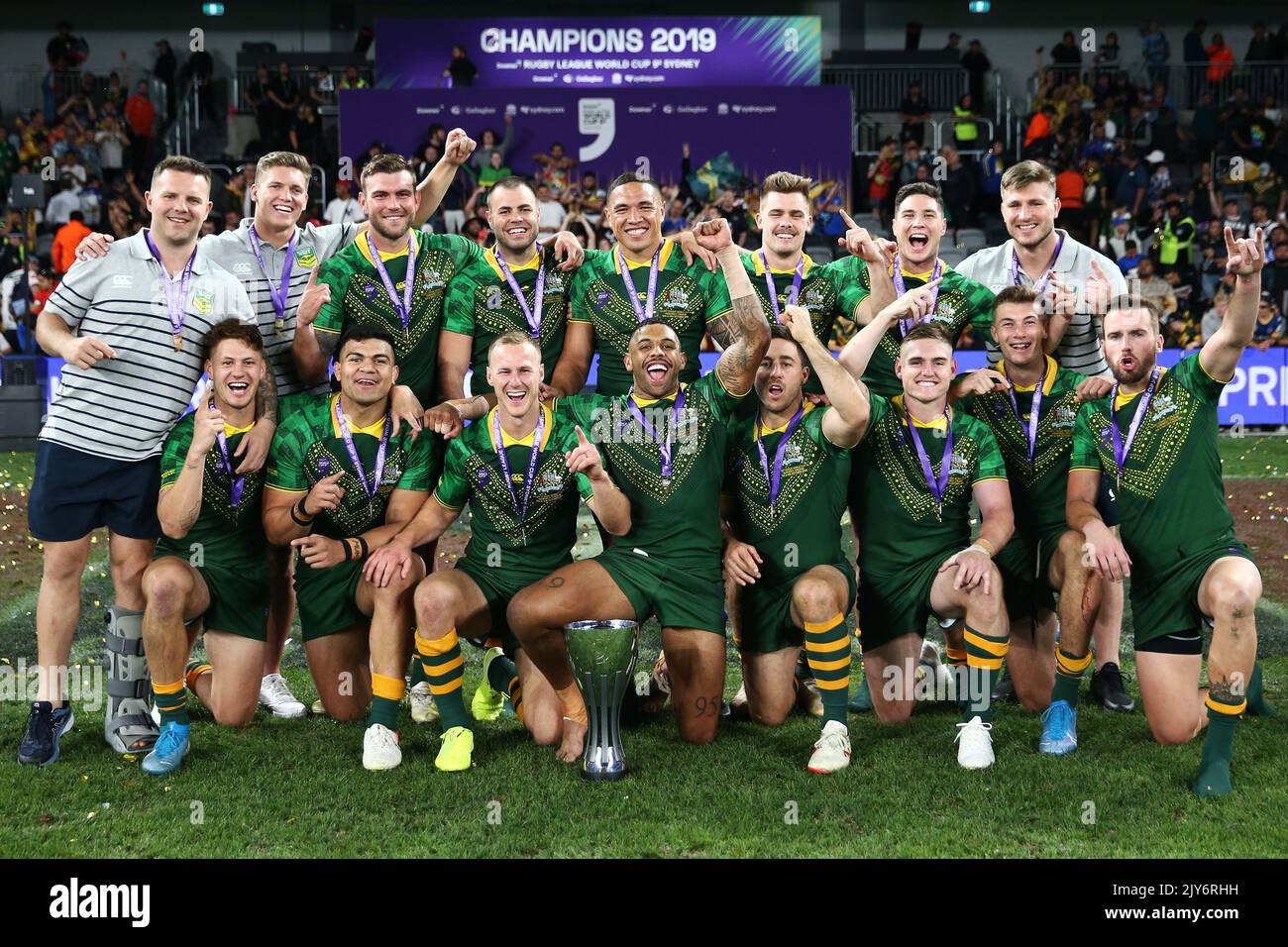 Players from Australia celebrate with the trophy after victory in the ...