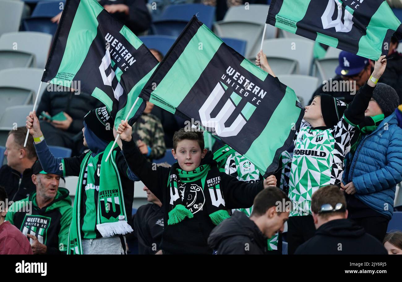Western United supporters in the crowd show their support during the ...