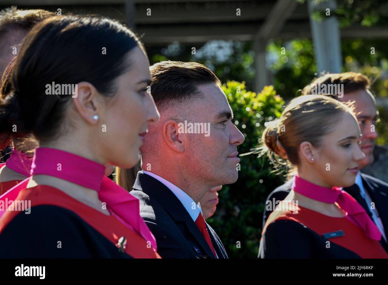 Qantas cabin crew are seen during a press conference at Sydney ...