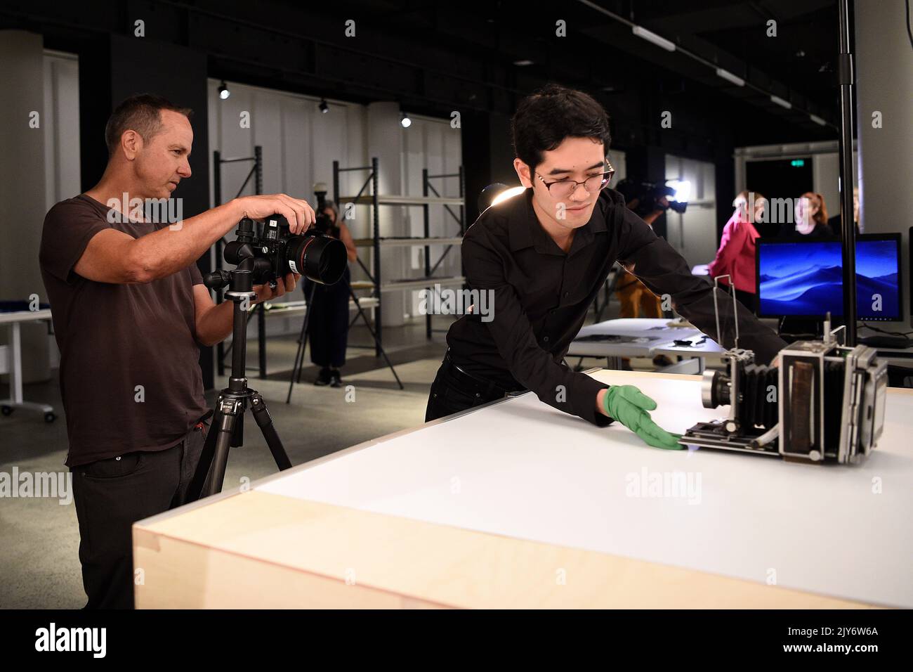 Museum preservation team members are seen during the launch of the ...