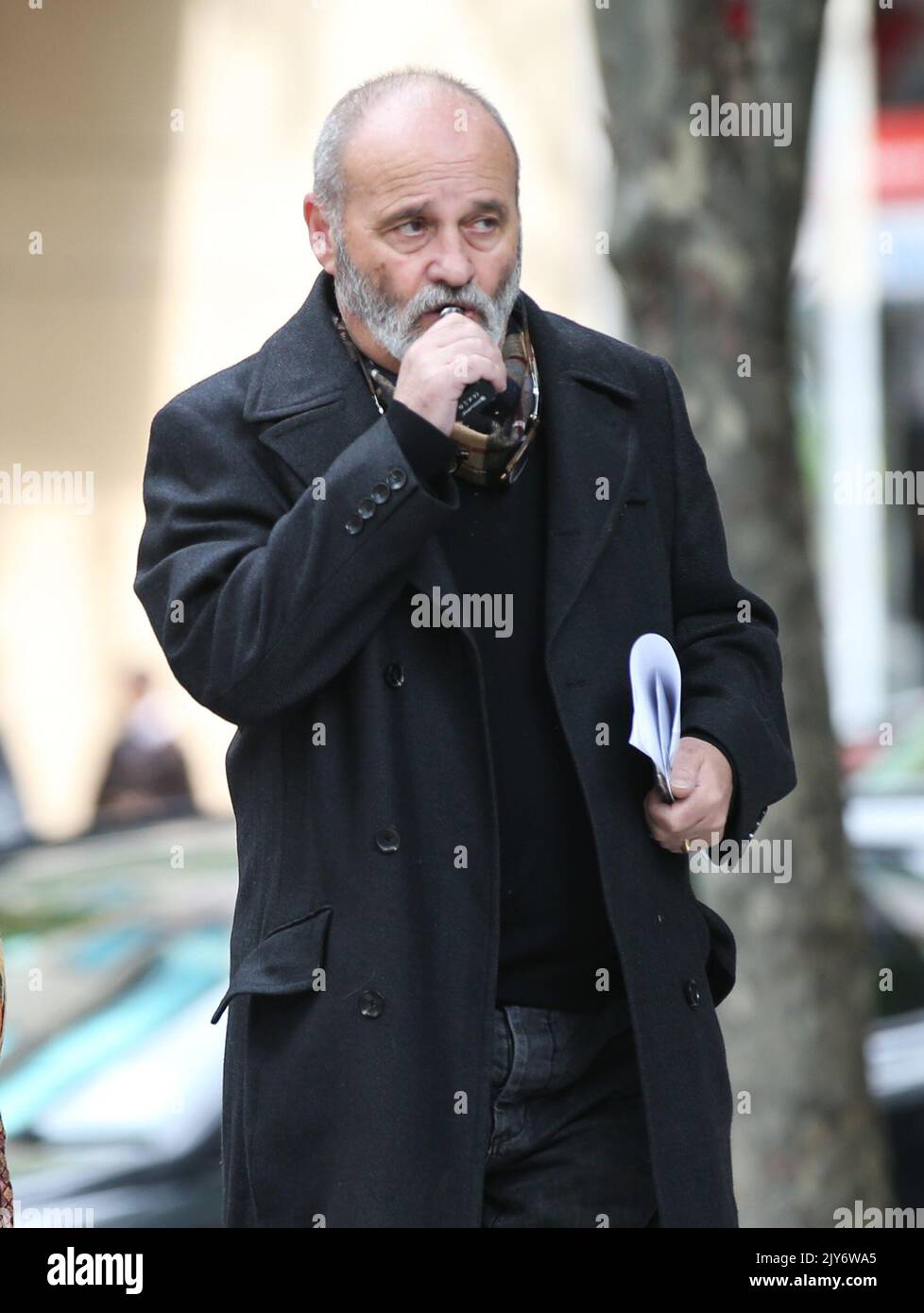 Lawyer John Anile arrives at the County Court of Victoria in Melbourne ...
