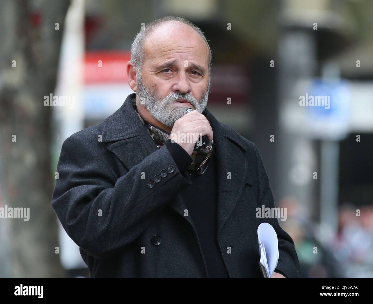 Lawyer John Anile arrives at the County Court of Victoria in Melbourne ...