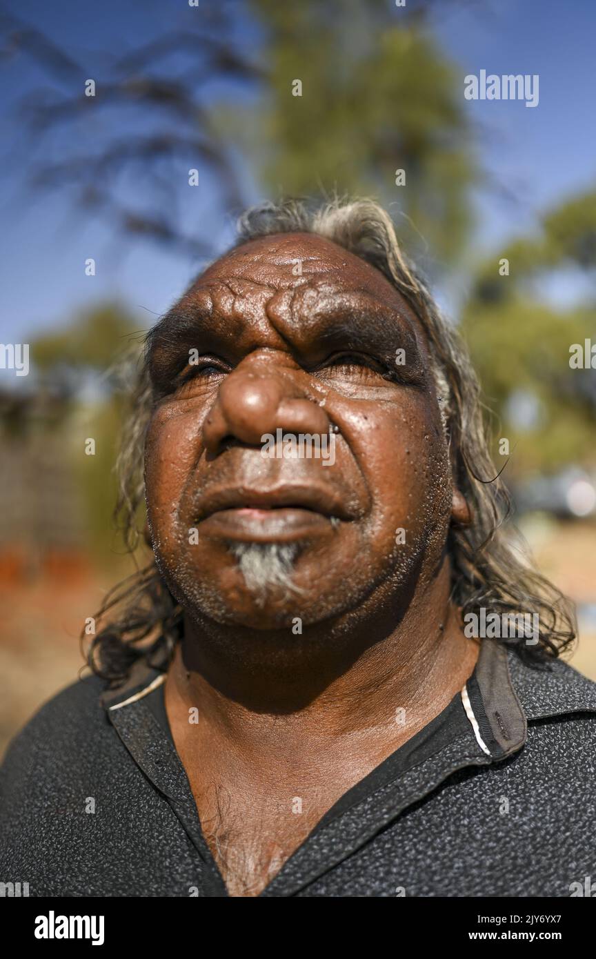 Mutitjulu Community resident Xavier Kitson poses for photographs near ...
