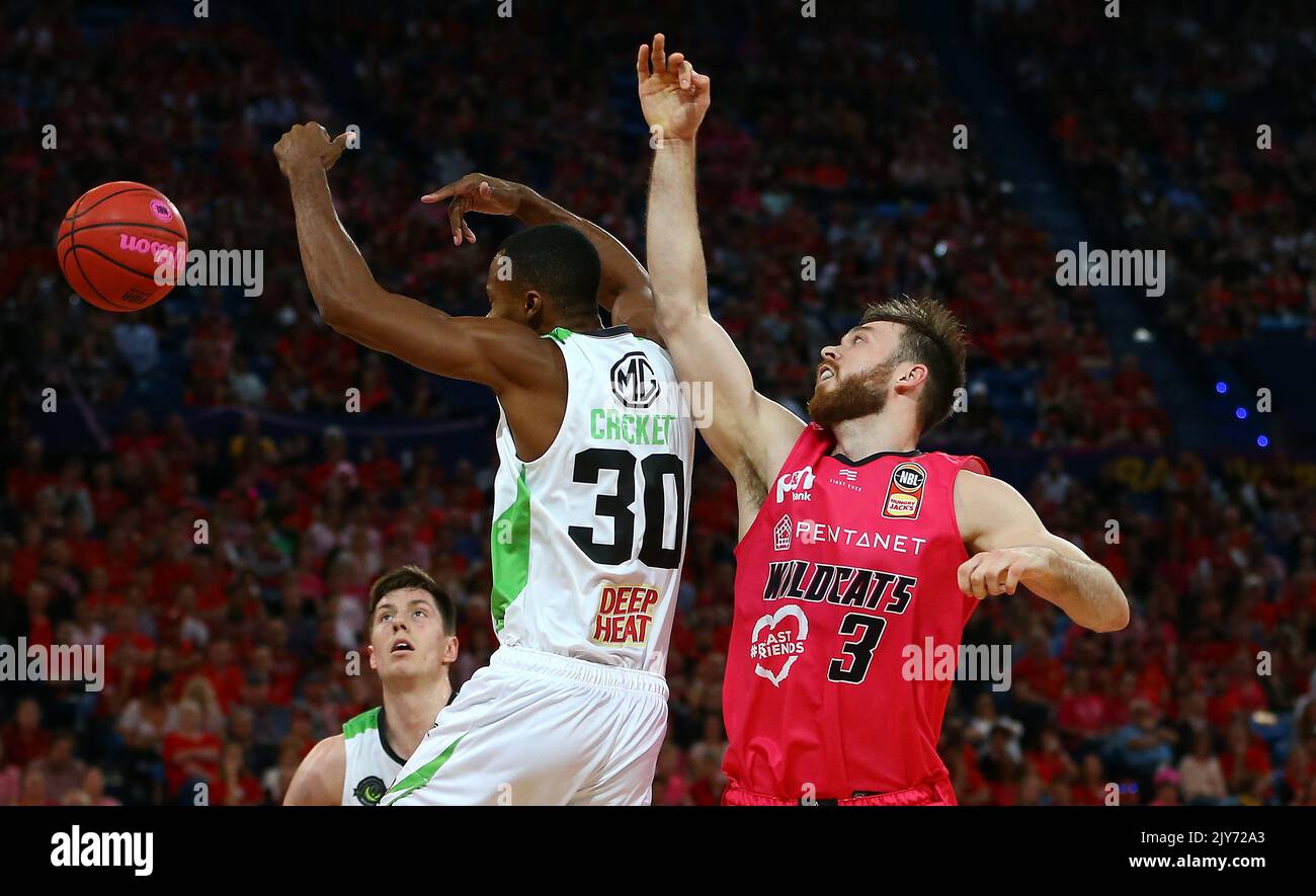 Nicholas Kay of the Wildcats knocks the ball away from Jaye Crockett of ...