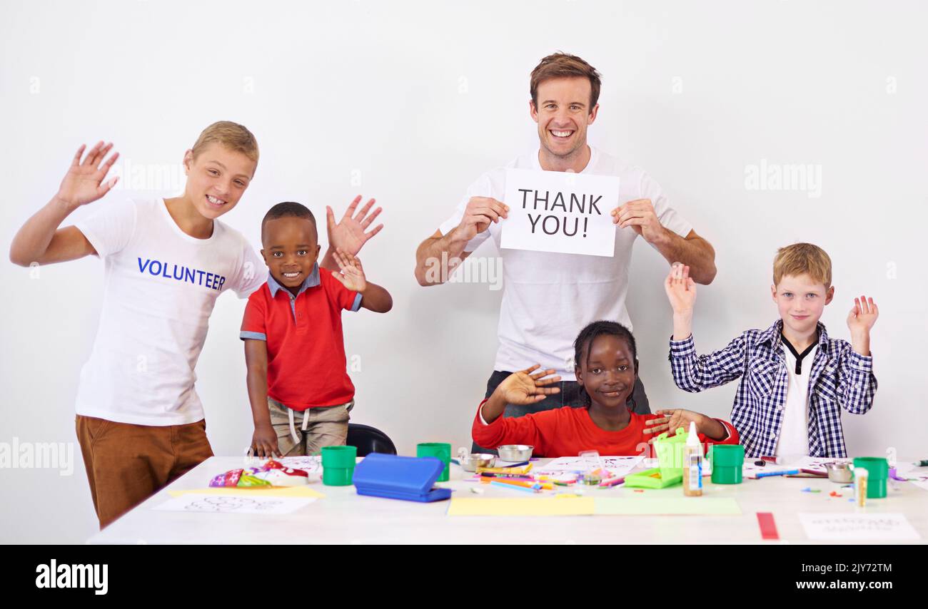 Volunteering is its own reward. Portrait of a volunteer holding up a ...