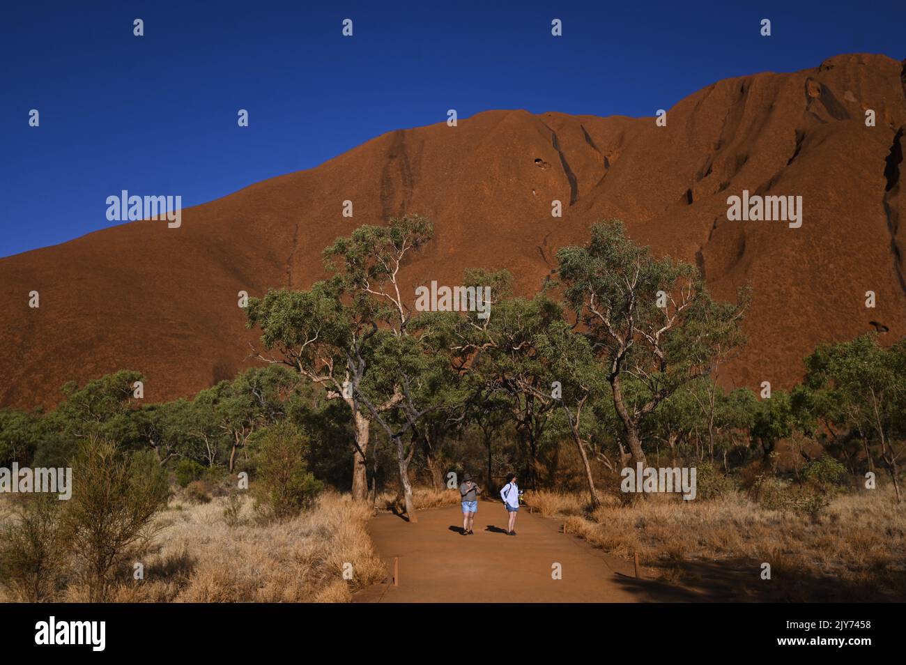 Tourists are seen on the Mala walk at Uluru-Kata Tjuta National Park in ...