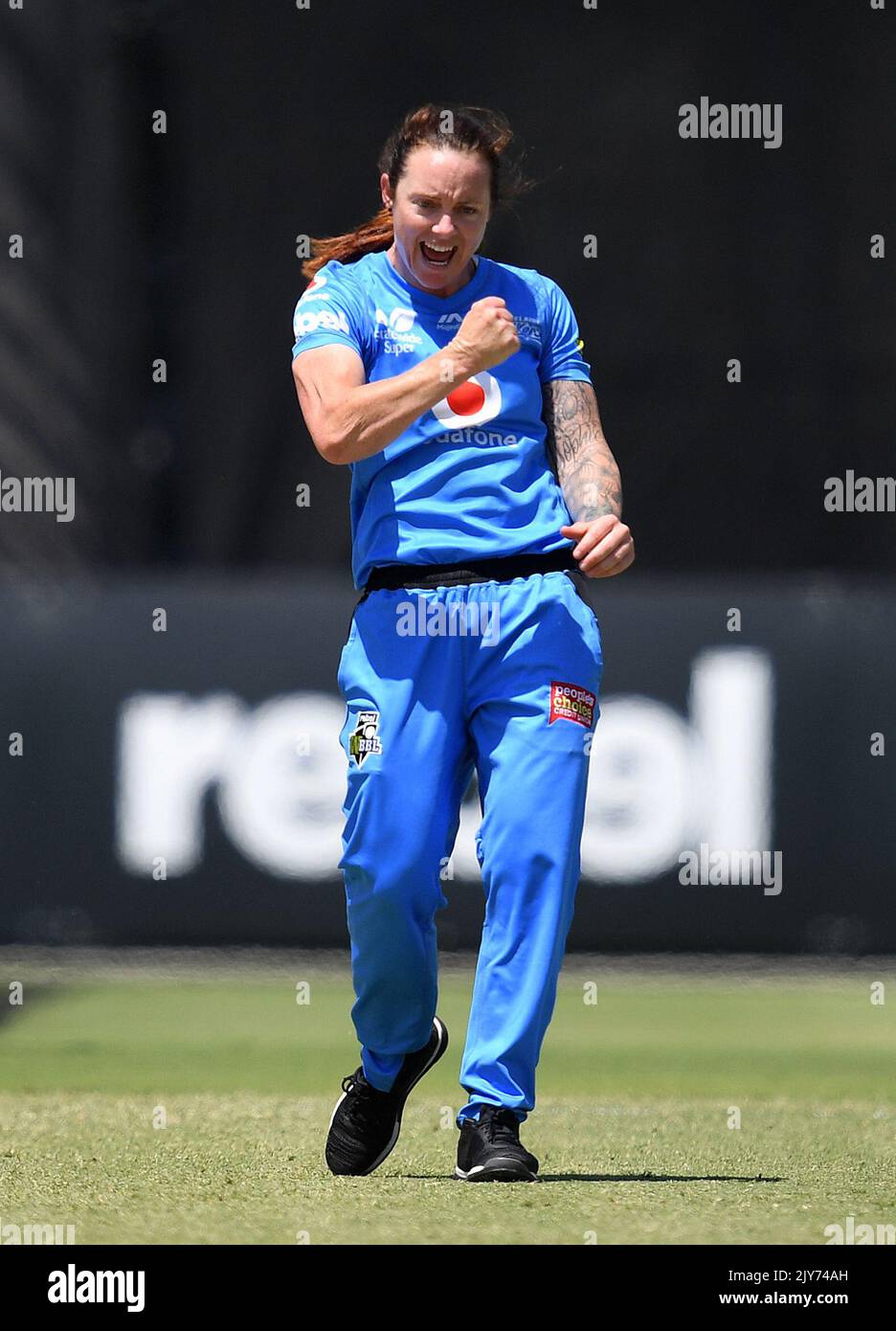 Sarah Coyte of the Strikers celebrates taking the wicket of Chloe ...
