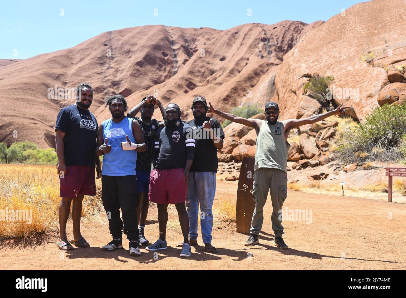 Members of the Mala Band pose for photographs at the mall Walk at Uluru ...