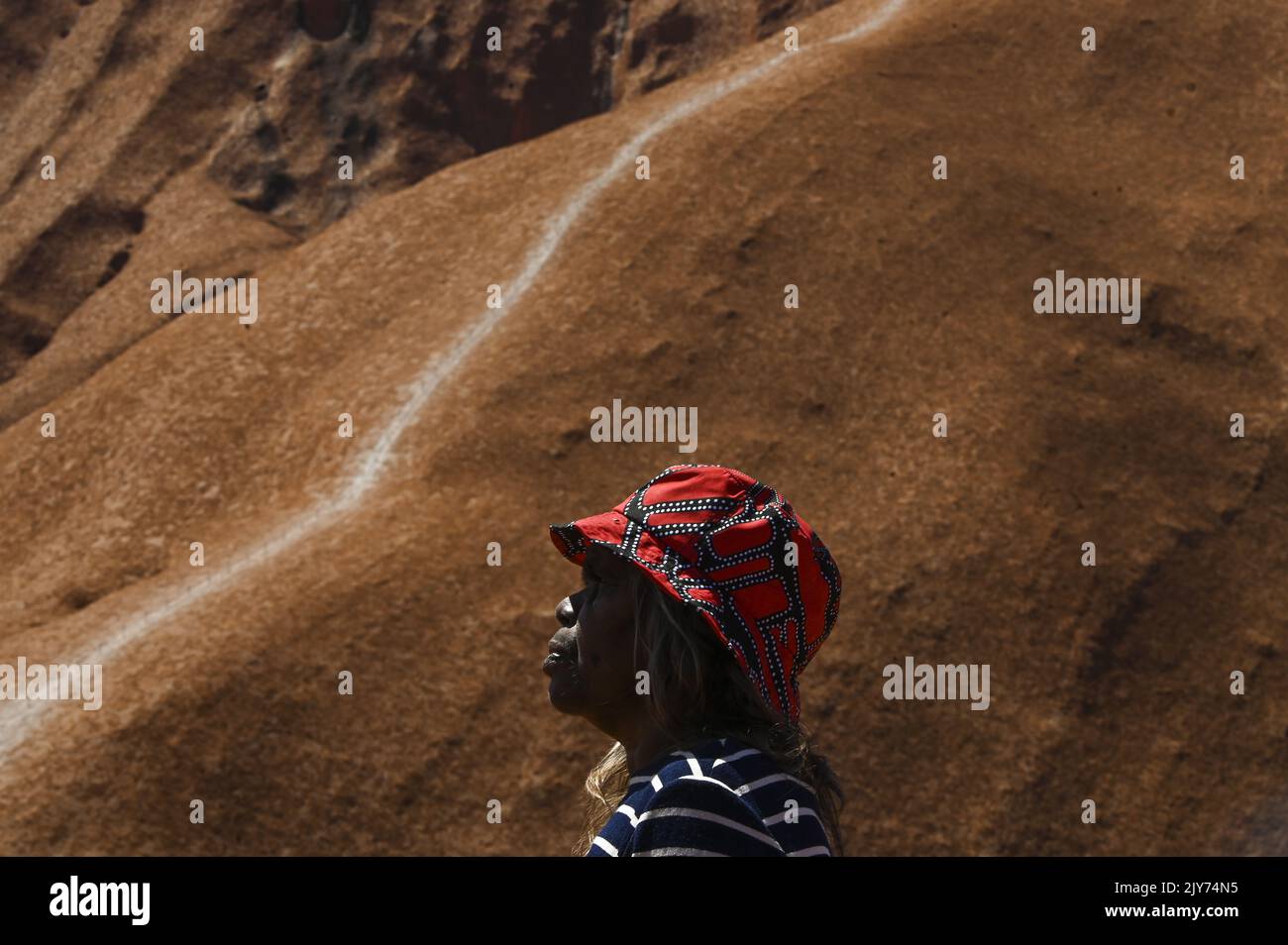 Rene Kulitja, a Pitjantjatjara artist poses for photographs in front of ...