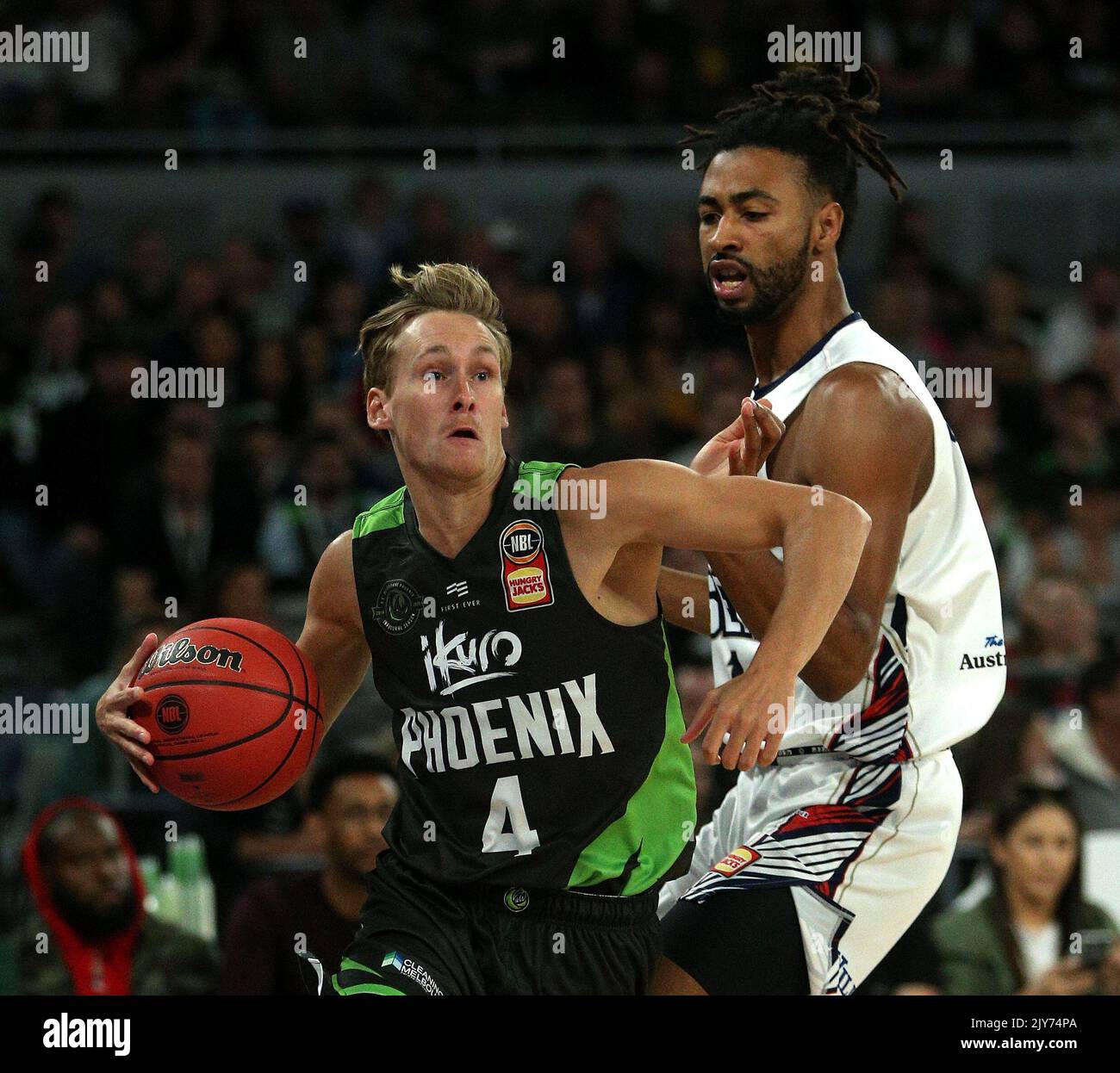 Kyle Adnam of the Phoenix (left) contests with Obi Kyei of Adelaide ...