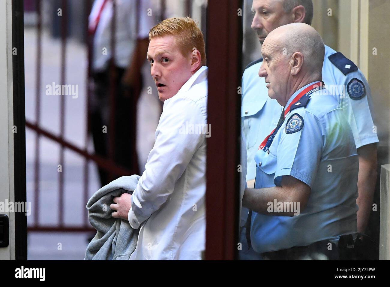 Travis Wills (left) departs the Supreme Court of Victoria, Melbourne ...