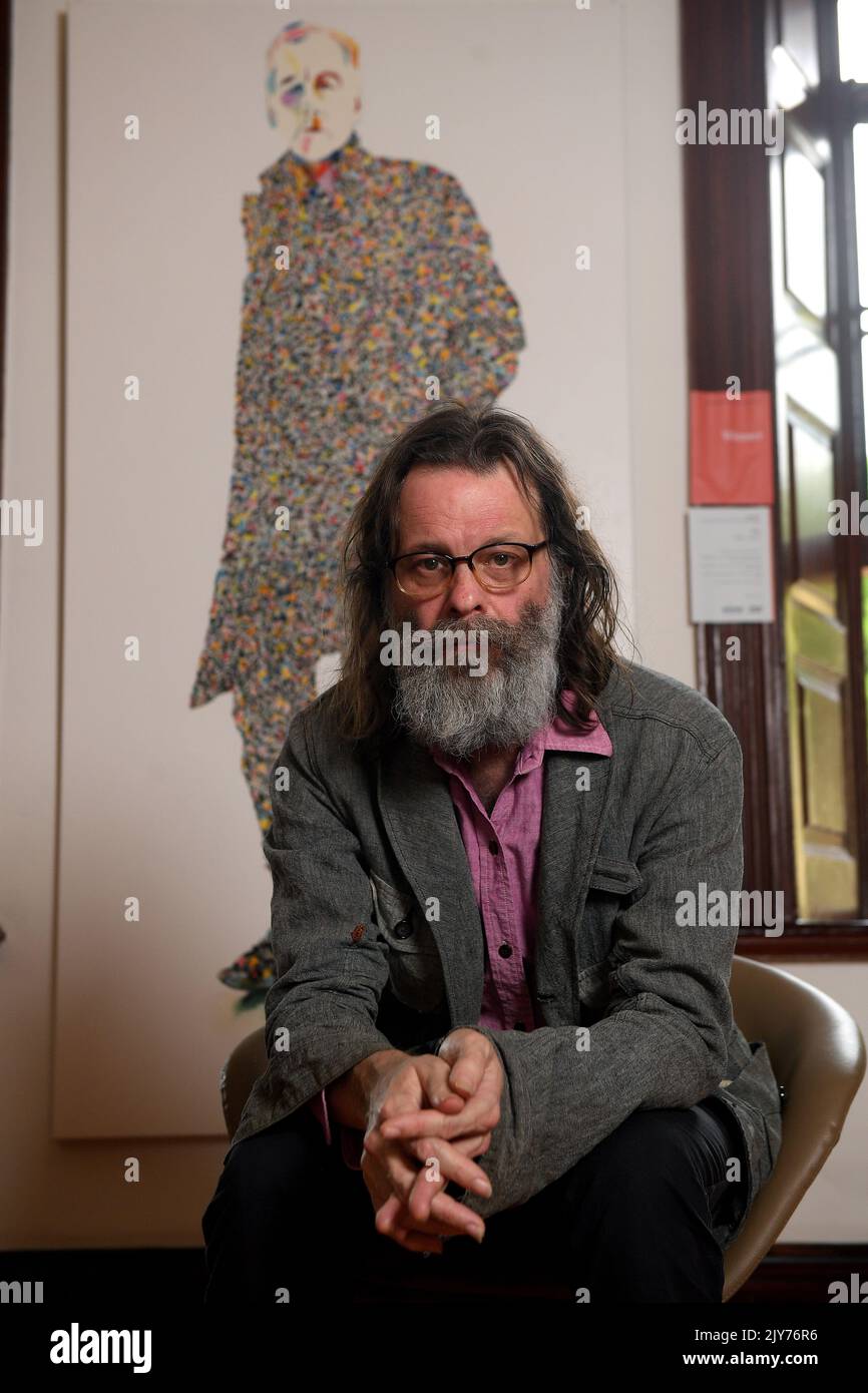 Australian artist What poses for a photograph with his work Robert ...