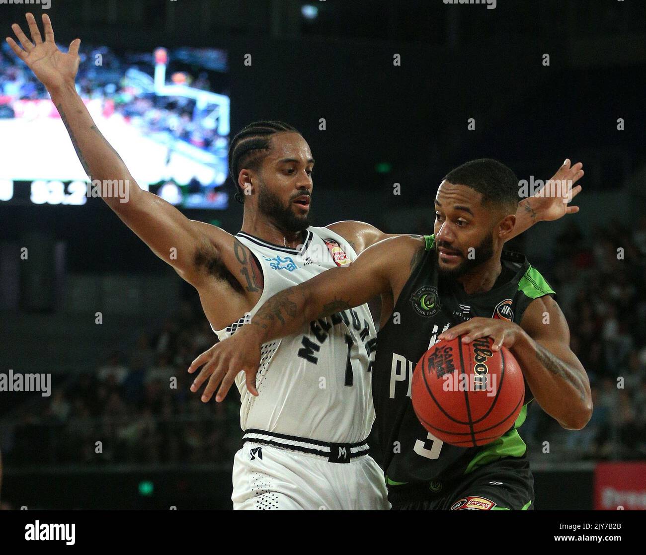 John Roberson of the Phoenix (right) contests with Melo Trimble of ...