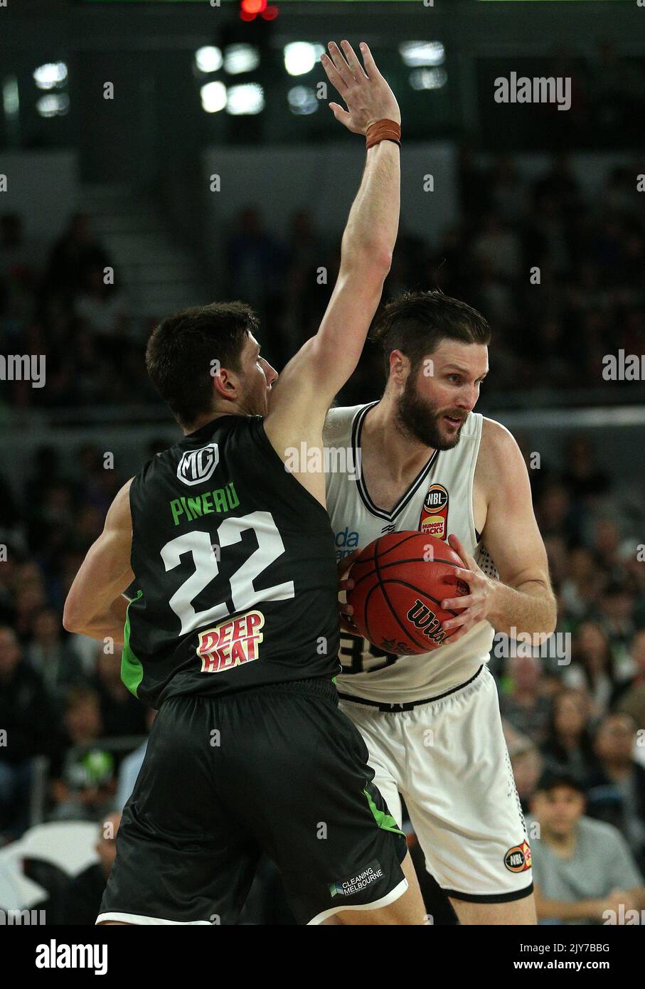 Alex Pledger of Melbourne United (right) contests with Dane Pineau of ...