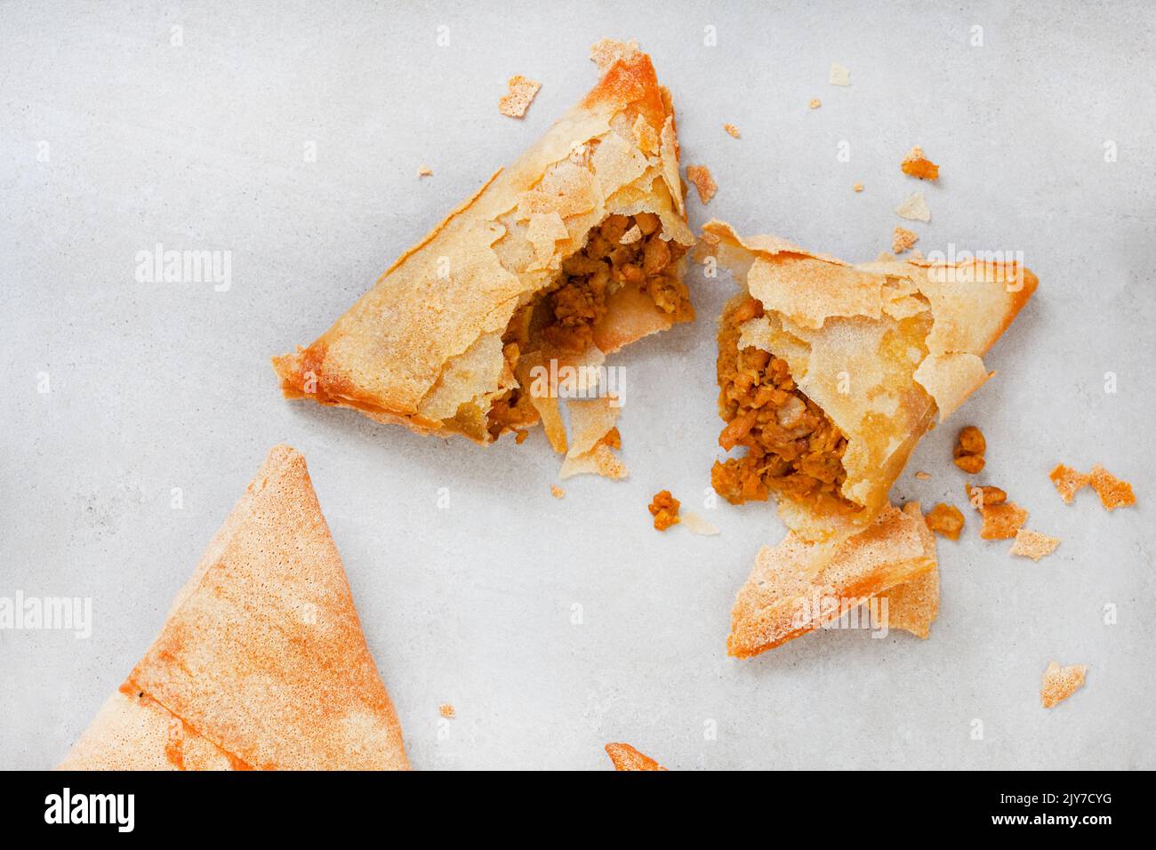 South African chicken Samosas on rustic table Stock Photo - Alamy