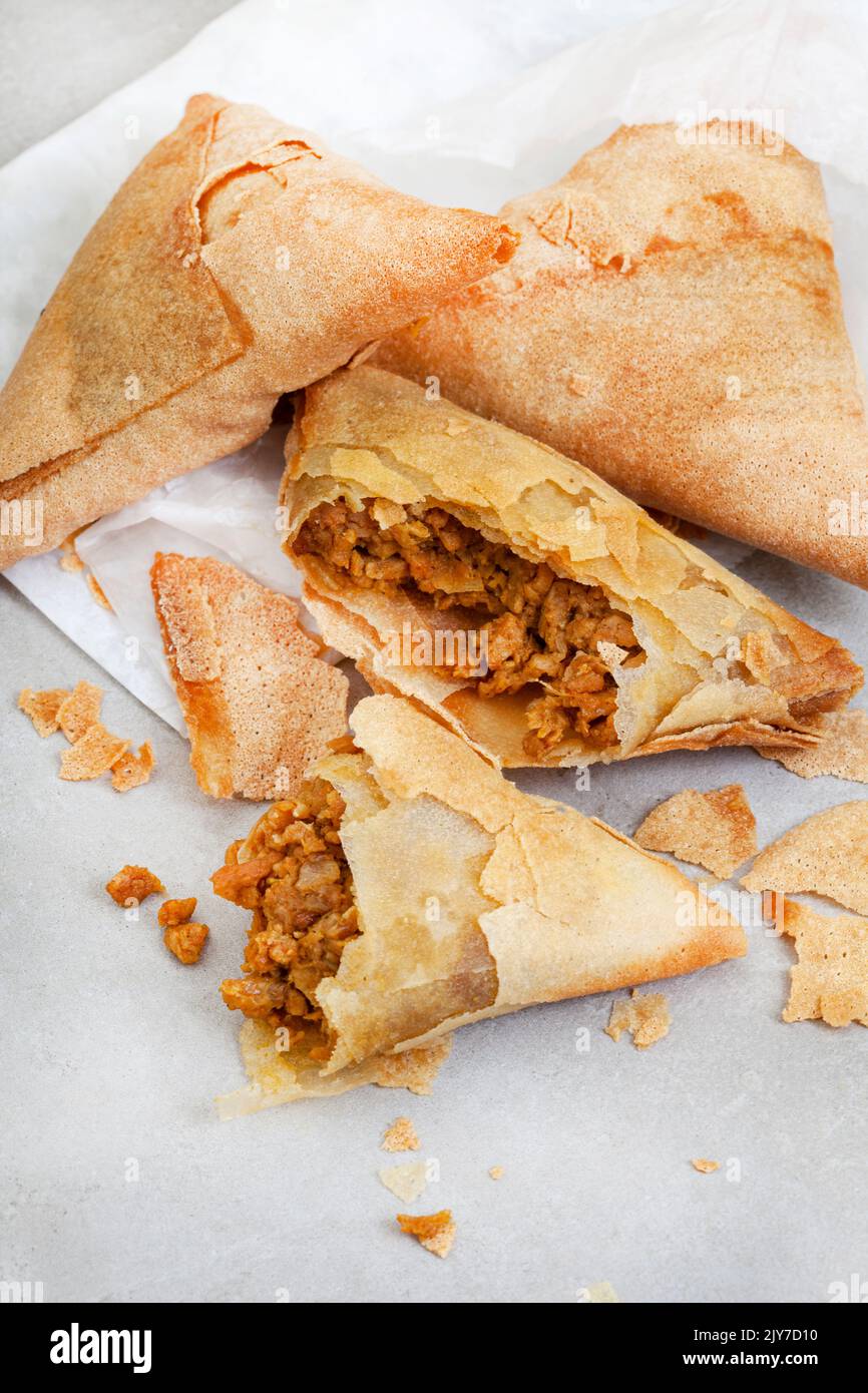 South African chicken Samosas on rustic table Stock Photo - Alamy