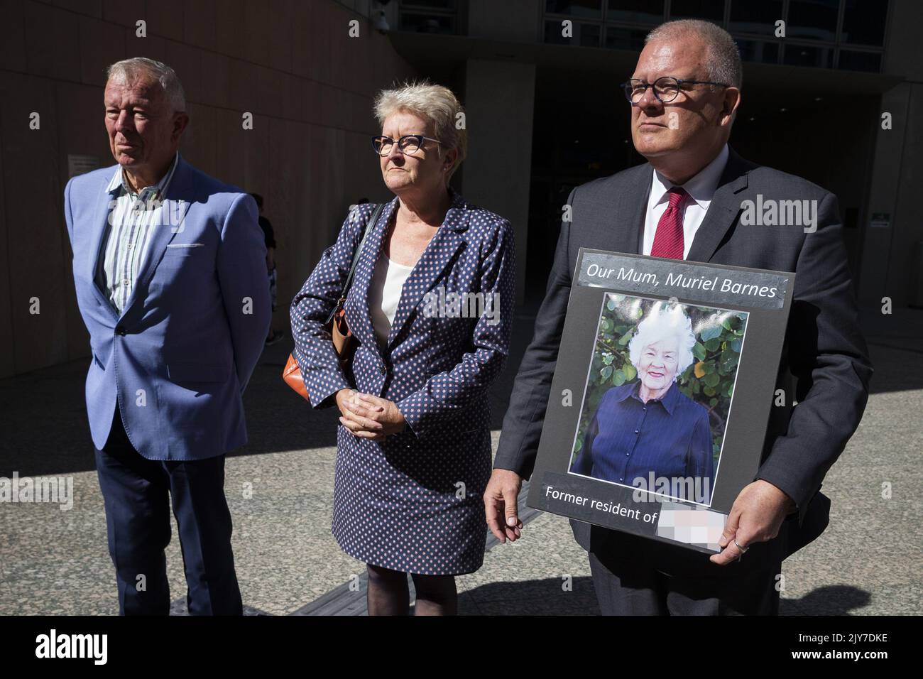 (L-R) Siblings Graham, Debra and Michael Barnes pose for a photograph ...
