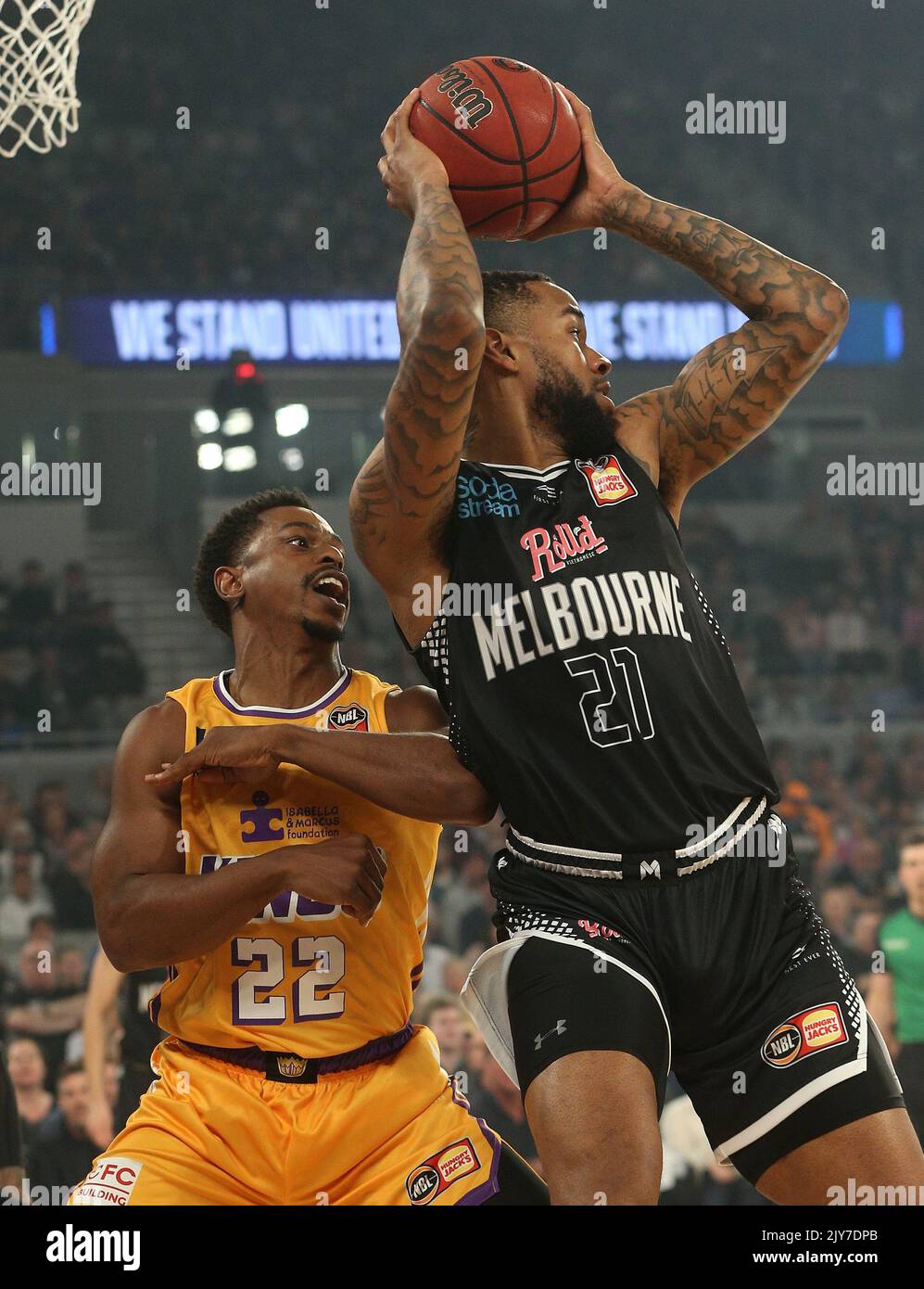 Shawn Long of Melbourne United (right) contests with Casper Ware of ...