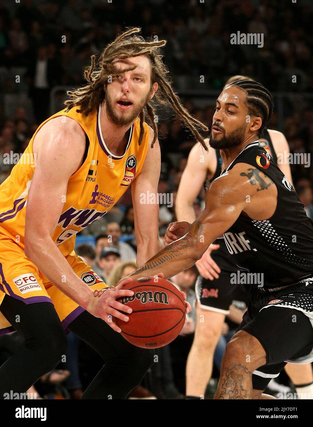 Craig Moller of Sydney (left) contests with Melo Trimble of Melbourne ...