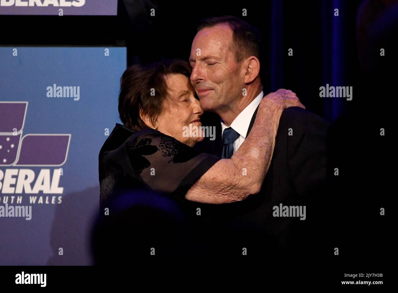 Former prime minister Tony Abbott is embraced by his mum Fay Abbott ...