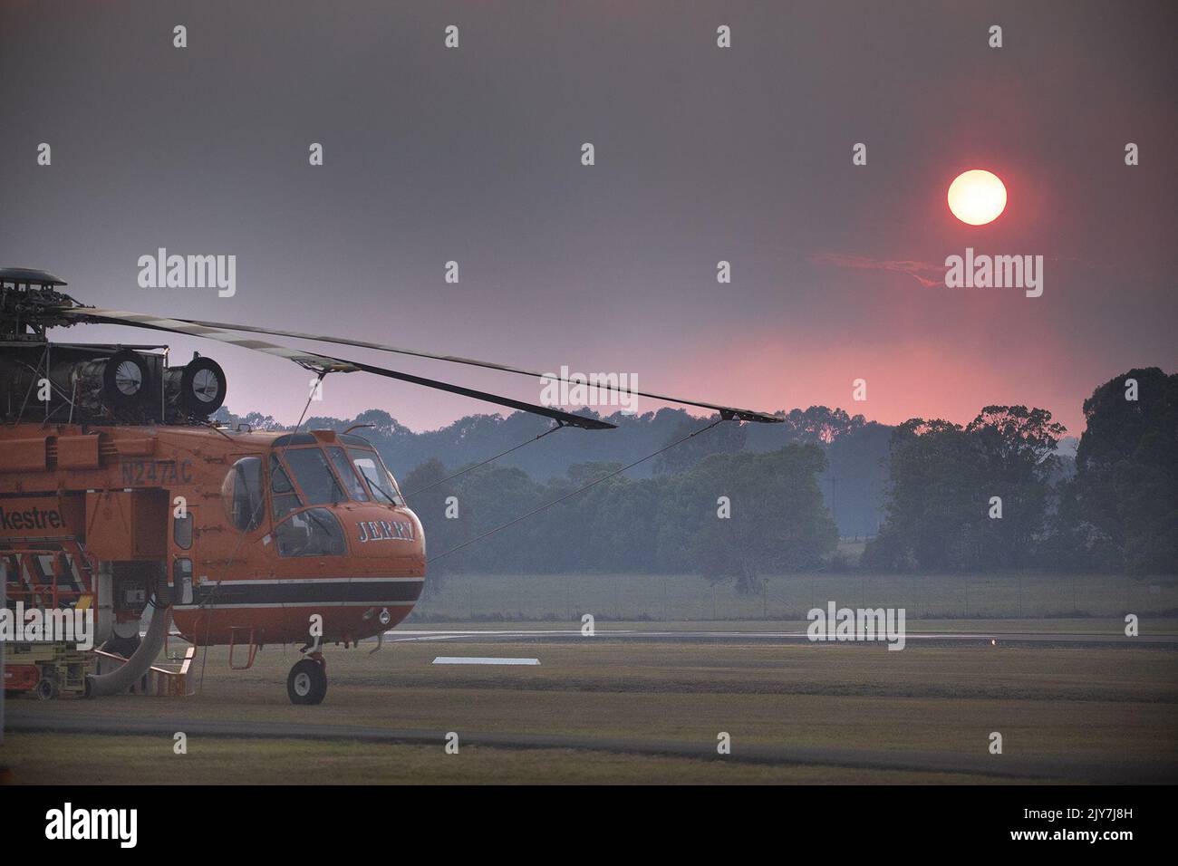 NSW Rural Fire Crews are seen around Taree in NSW, Saturday, November 9 ...