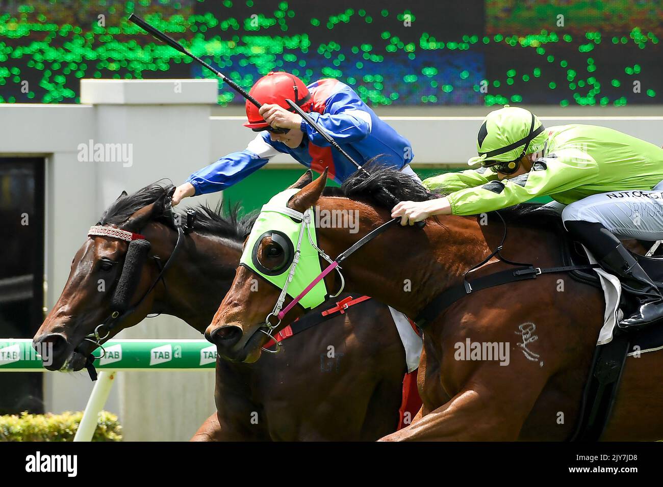 Jockey Jackson Murphy rides High Cost (right) to victory in race 2, the ...