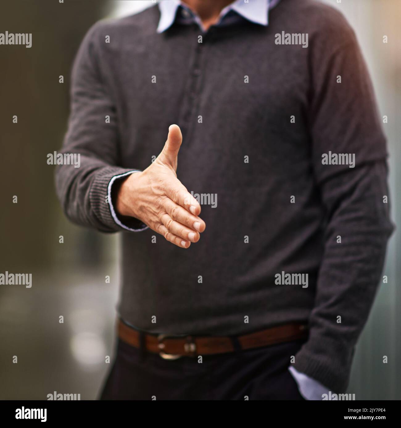 Never miss an opportunity to network. a businessman extending his arm ...