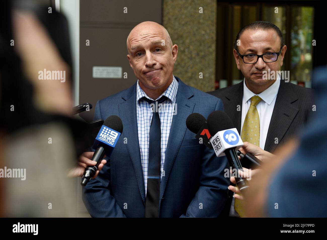 Manley Sea Eagles football manger John Bonasera (left) and lawyer Elias ...