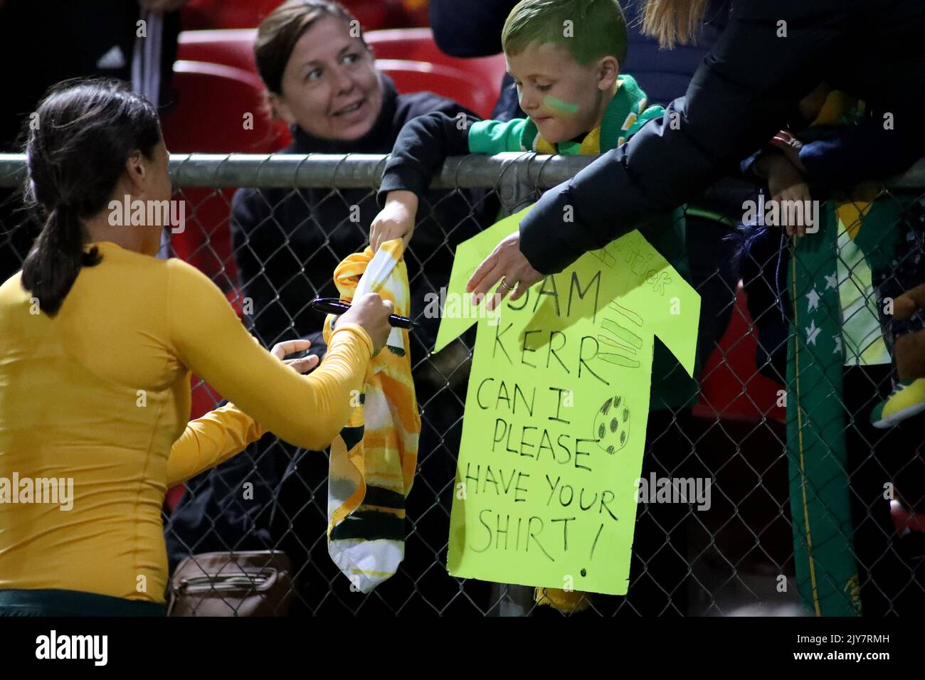 Sam Kerr of the Matildas gives Patrick Dobbin,6, her shirt during the ...