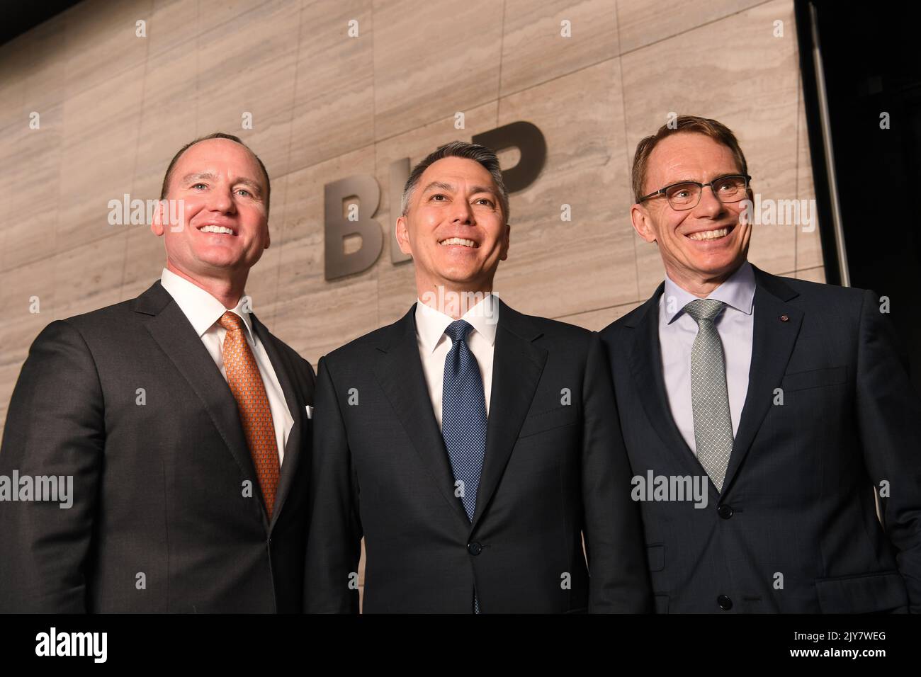 (L-R) BHP Chairman Ken MacKenzie, BHP CEO-Elect Mike Henry, BHP chief ...