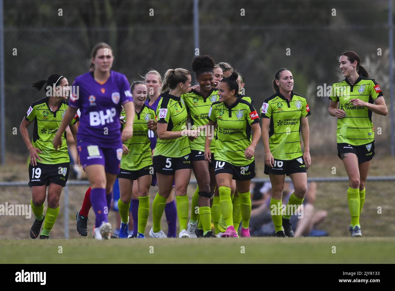 Simone Charley of Canberra United (centre) celebrates with team mates ...