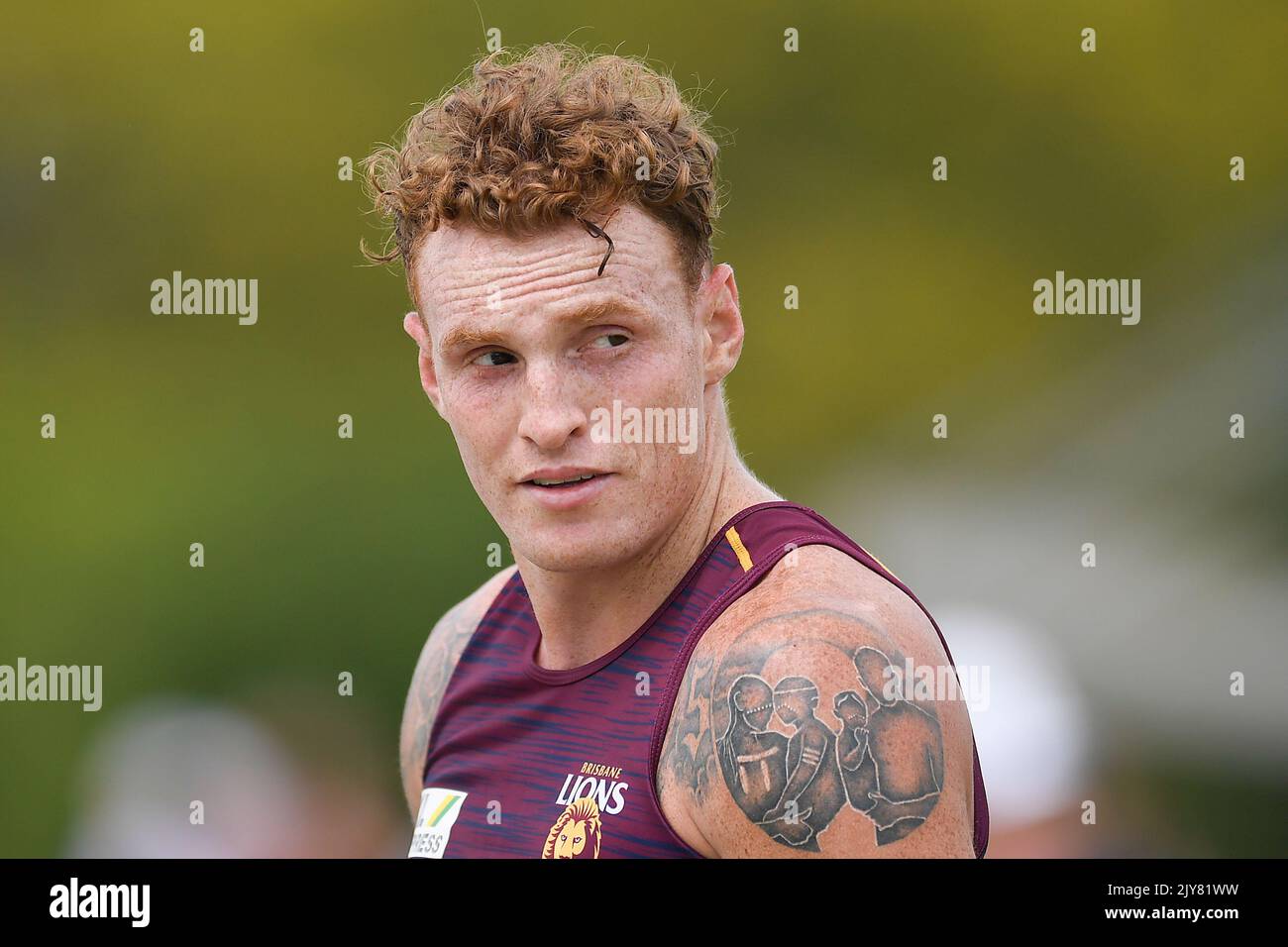 Mitch Robinson looks on during a Brisbane Lions training session at ...