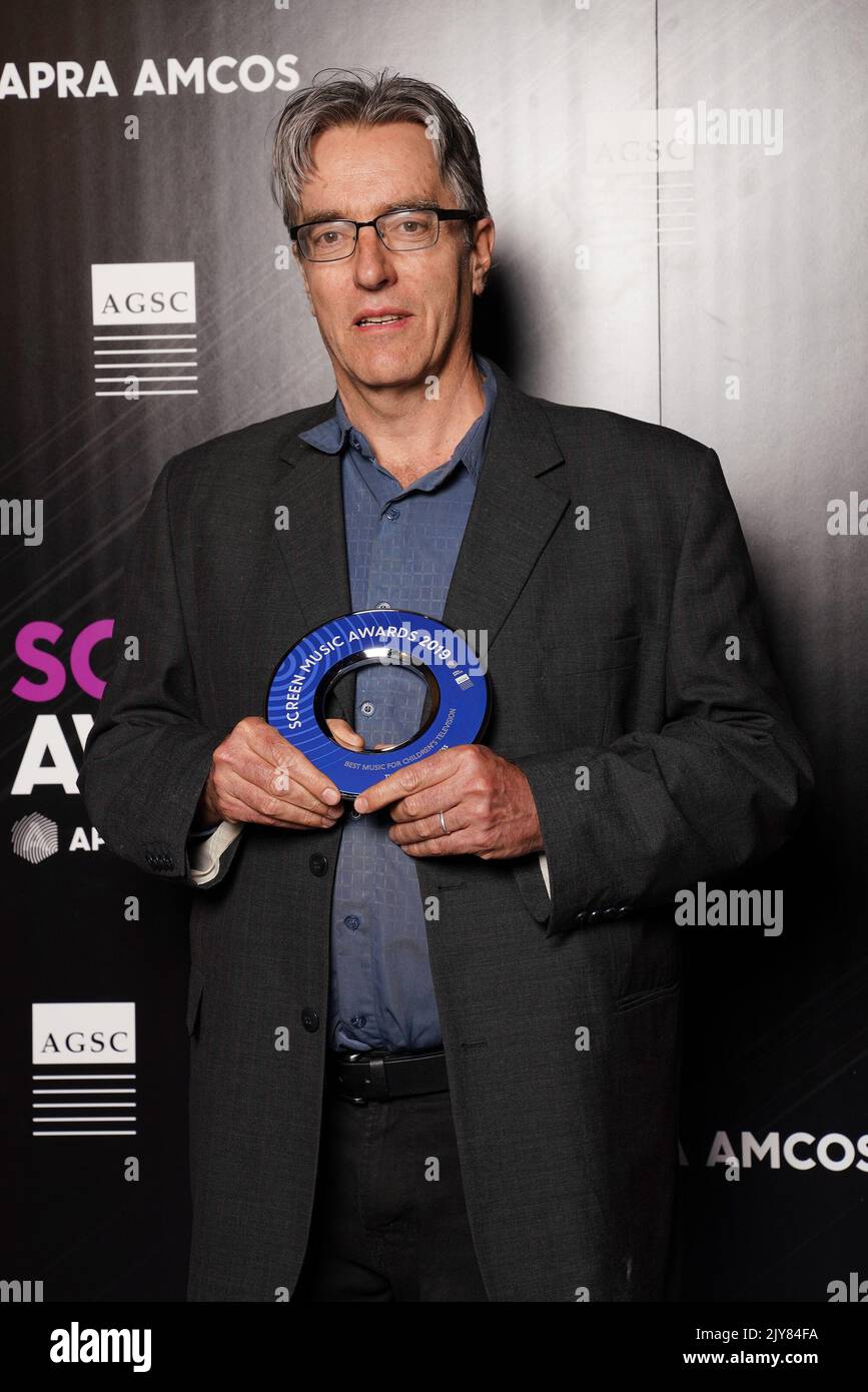 Michael Dooley poses after winning the Best Music for Children's ...